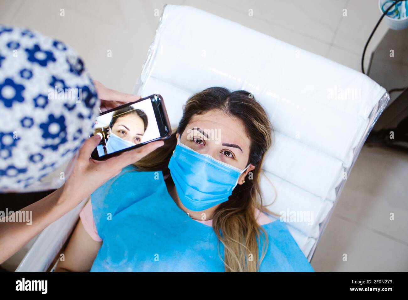 Latin woman Beautician Doing Eyebrow Tattooing For Female ...