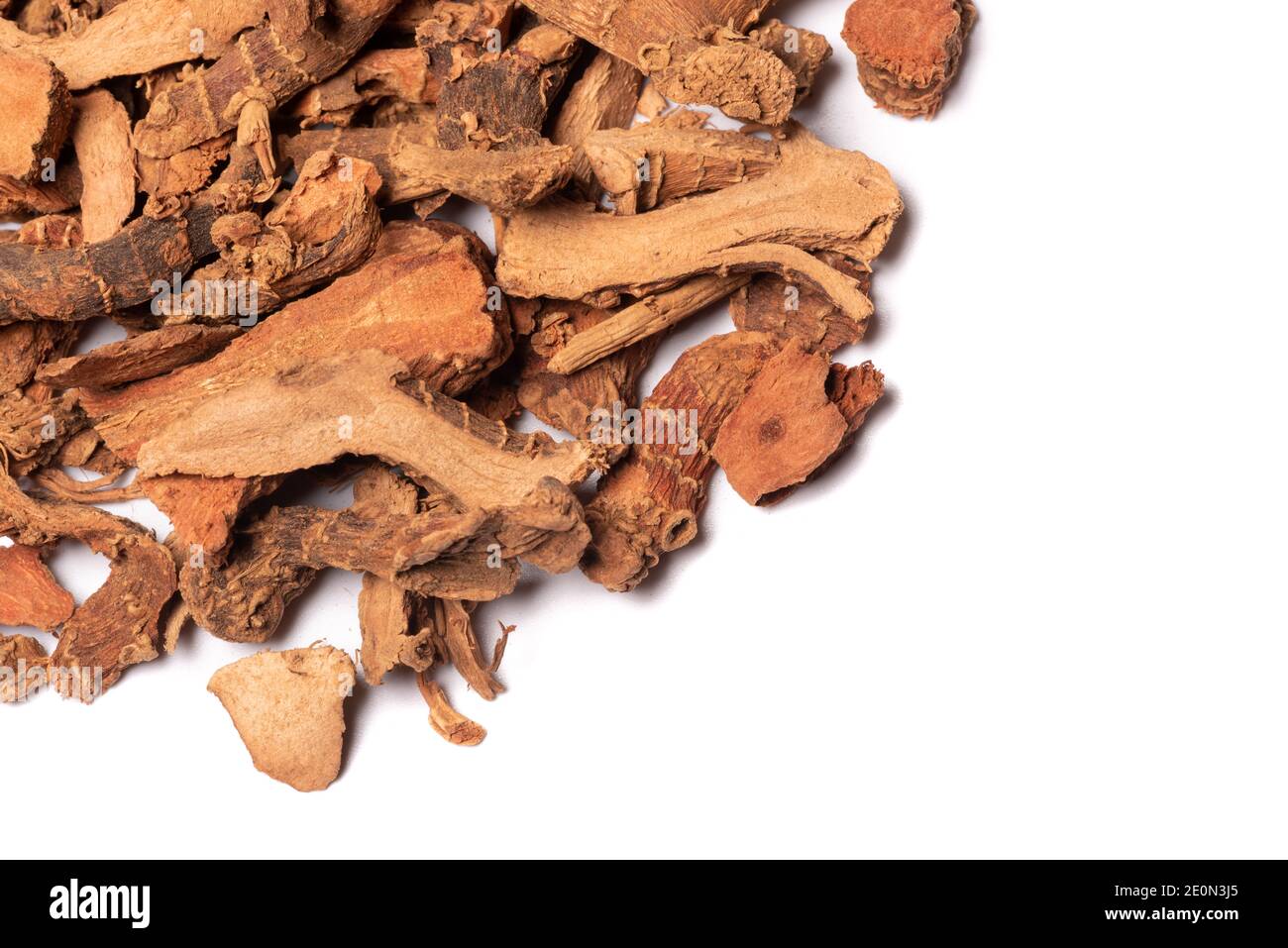 Lesser galangal, latin name Alpinia officinarum dried roots heap close ...