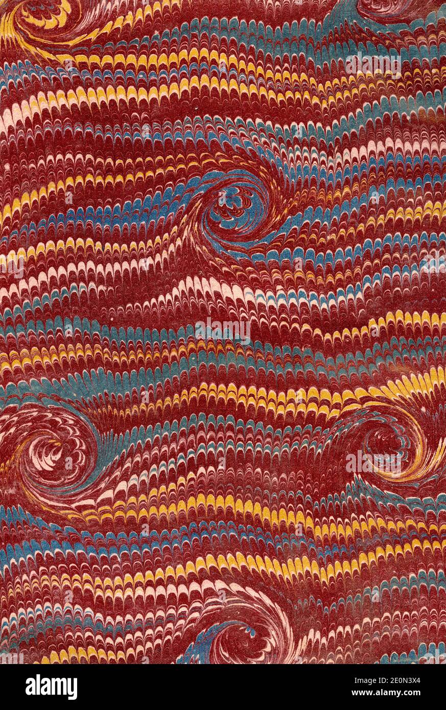 the marbled endpaper on a vintage book creates a striking textured ...