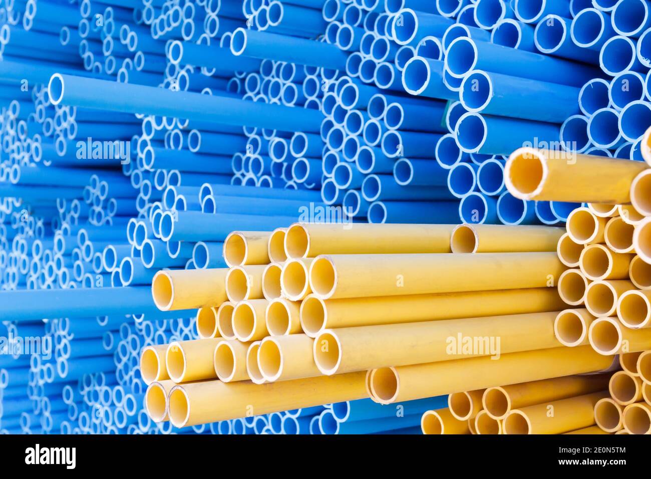 PVC pipes for electric conduit (yellow) and water (blue Stock Photo - Alamy
