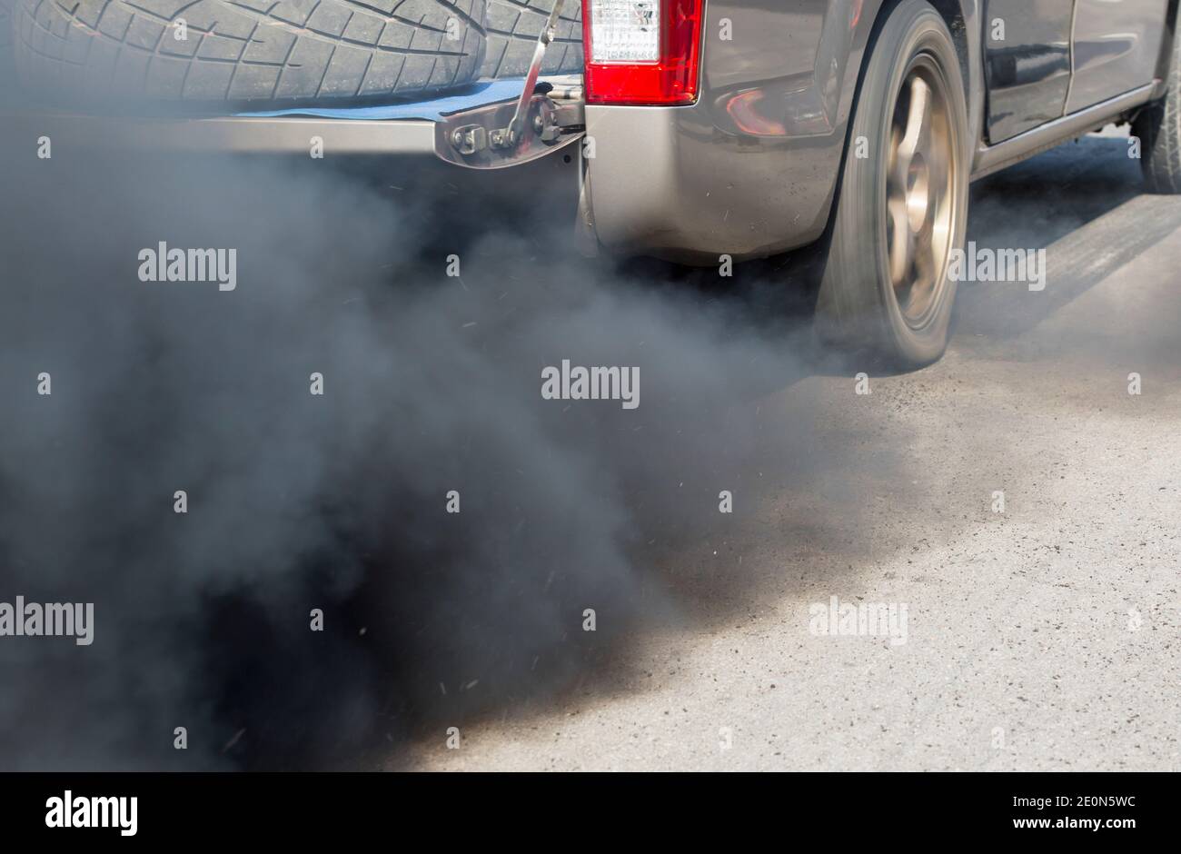 Air pollution from vehicle exhaust pipe on road Stock Photo - Alamy