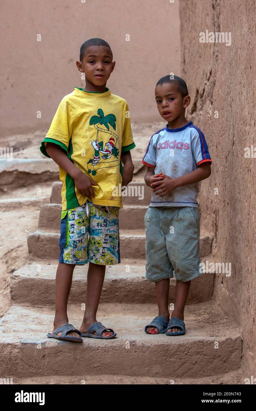 Moroccan boys stand in a street at Tinerhir in Morocco. Tinerhir is ...