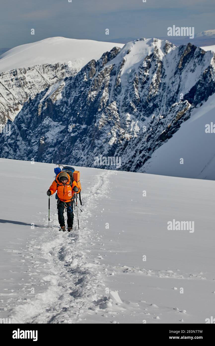 Two climbers walking on glacier with crevasse Stock Photo - Alamy