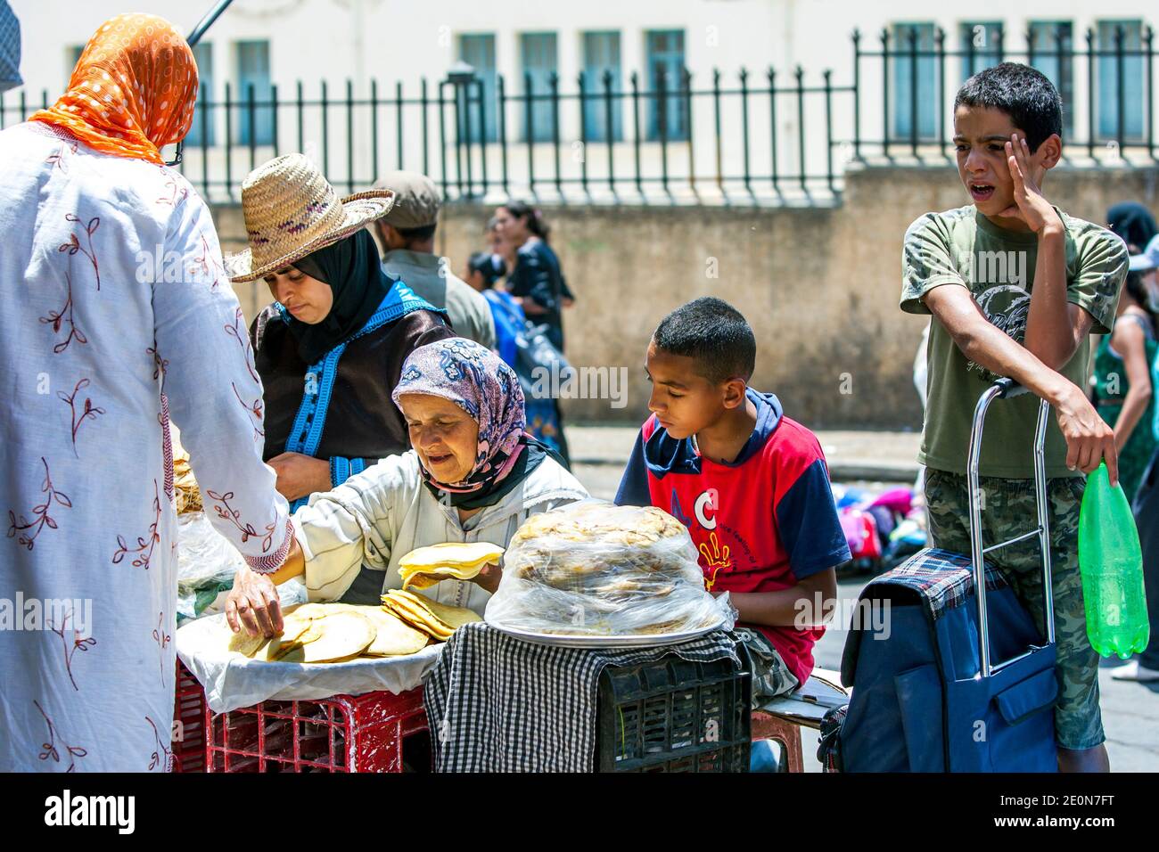 A lady selling flat bread adjacent to Lahdim Square in Meknes. Meknes ...