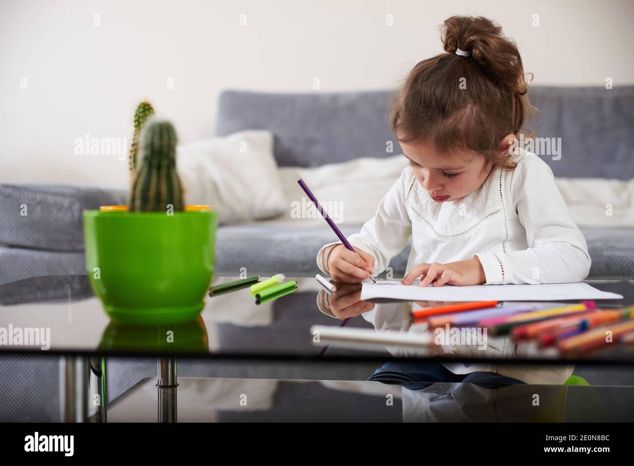 Beautiful girl focused on drawing. Concept of preschool education at ...