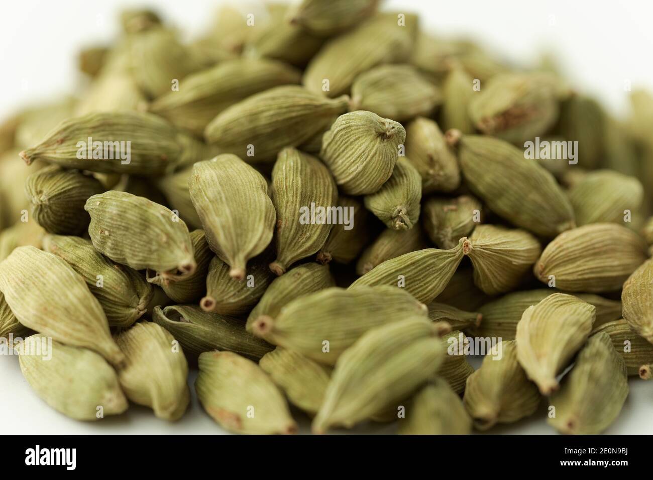 Indian spices-Cardamom small size on white background Stock Photo - Alamy