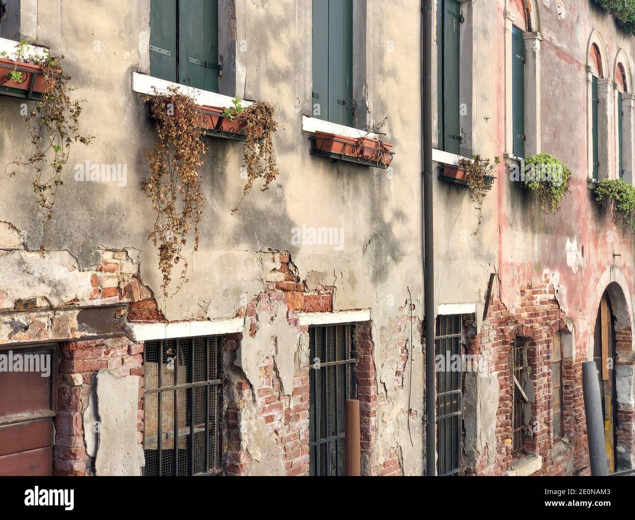 exterior of old building with worn brick walls in Italy Stock Photo - Alamy