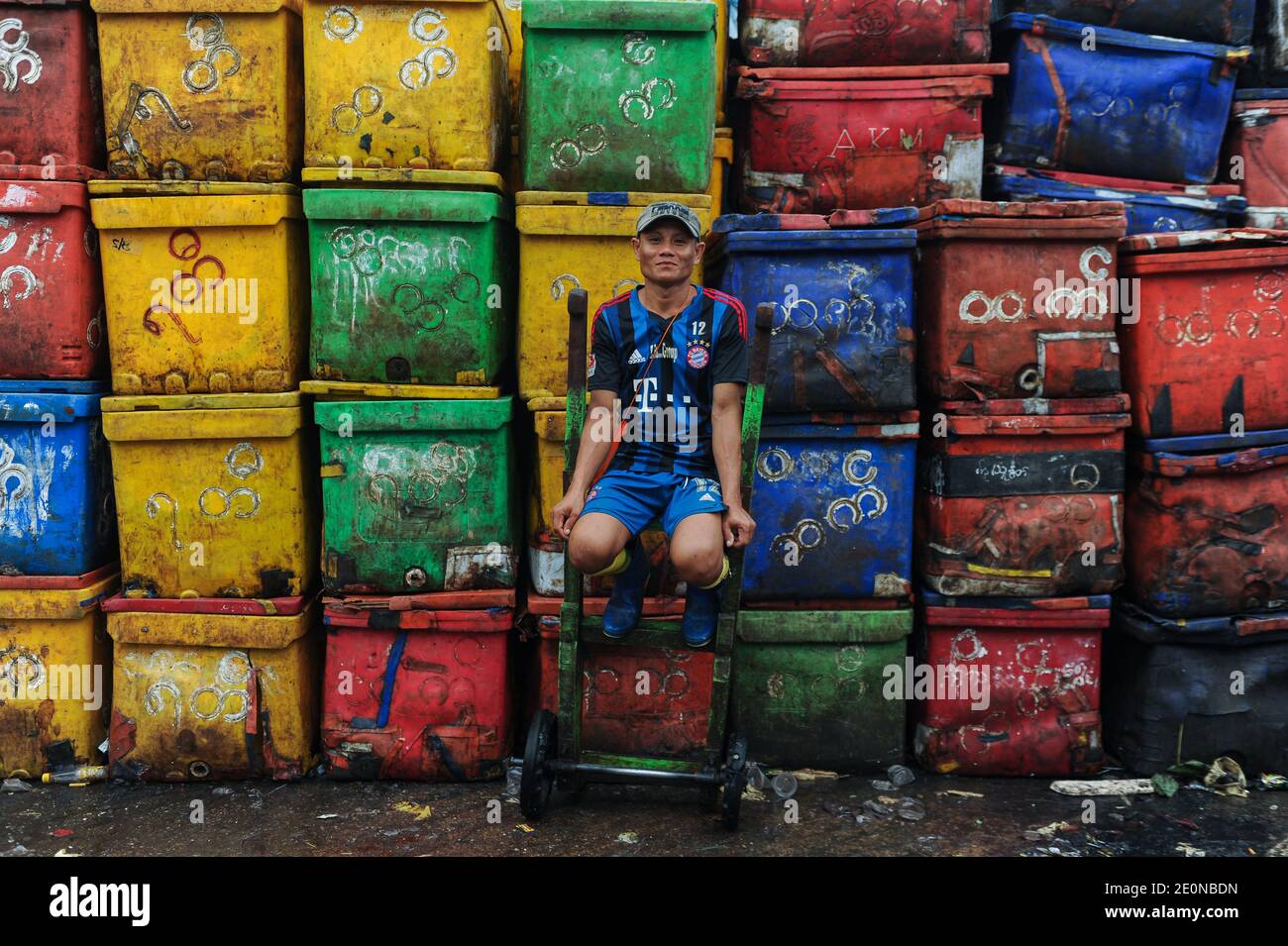 28.06.2014, Yangon, Myanmar, Asia - A worker sits on a handcart in ...