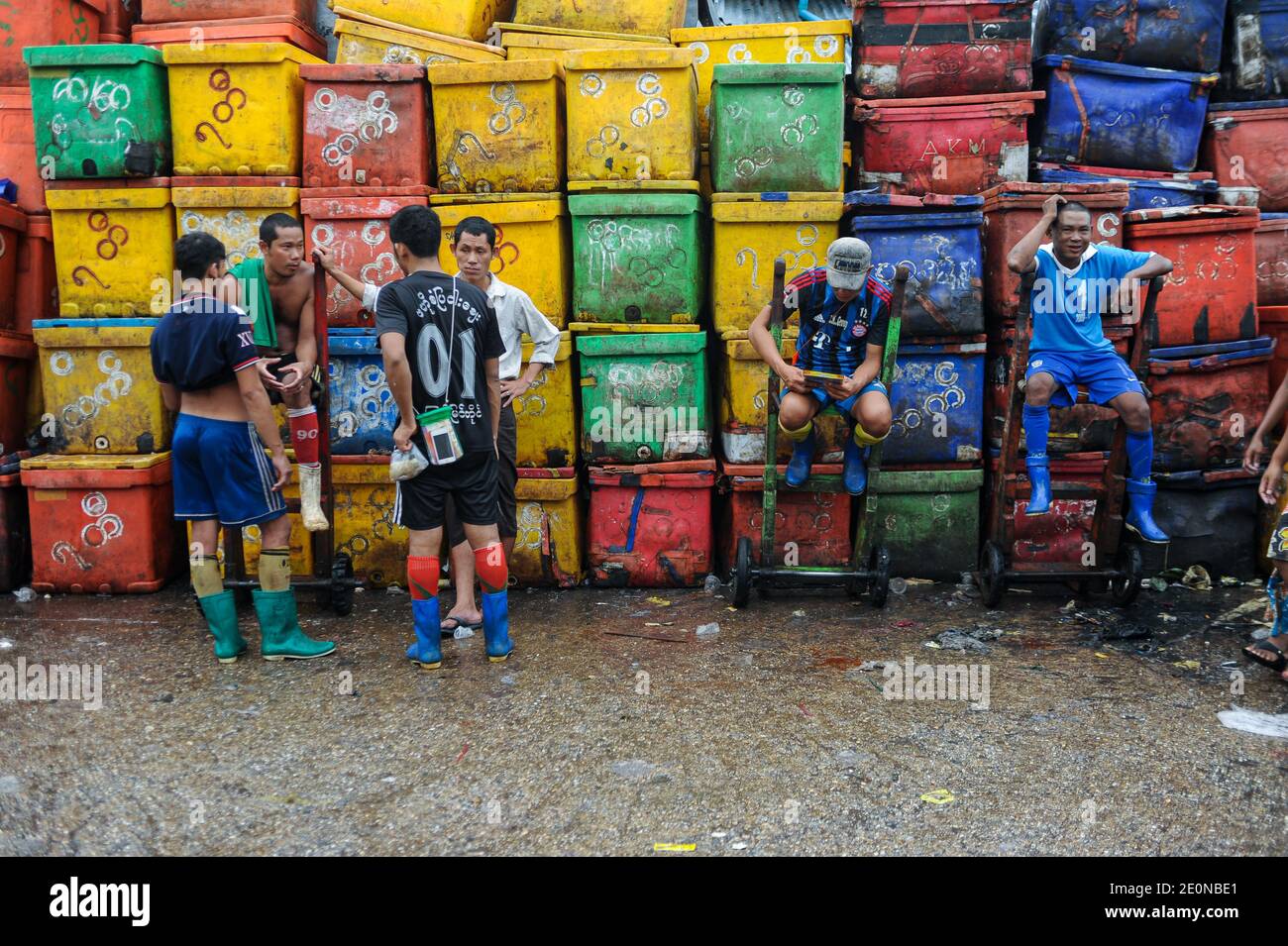 28.06.2014, Yangon, Myanmar, Asia - Workers with handcarts in front of ...