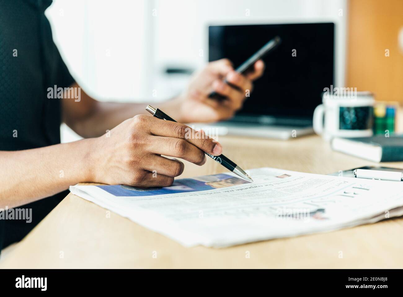 Looking at newspaper desk hi-res stock photography and images - Alamy