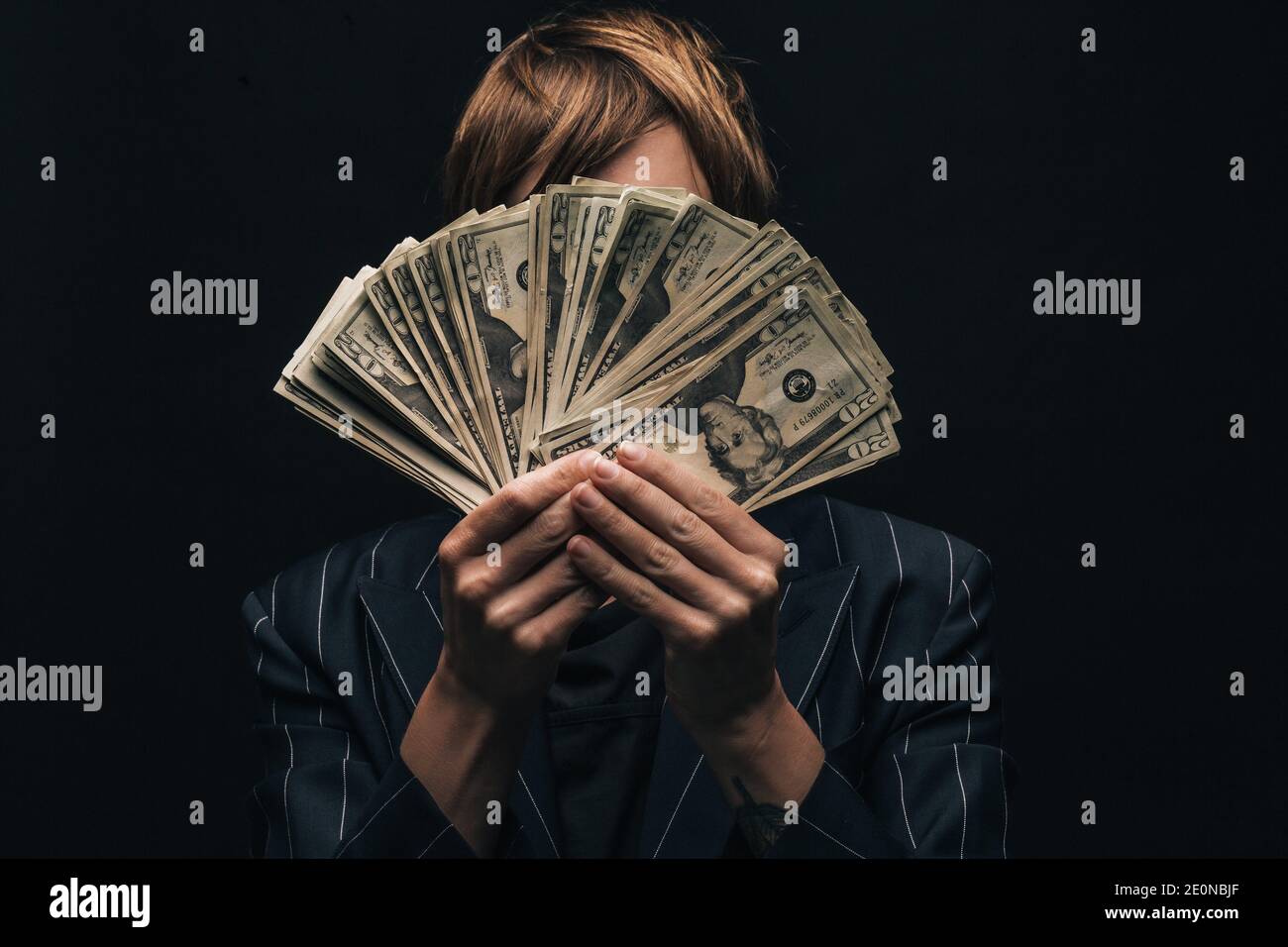 money hides face Stock Photo - Alamy
