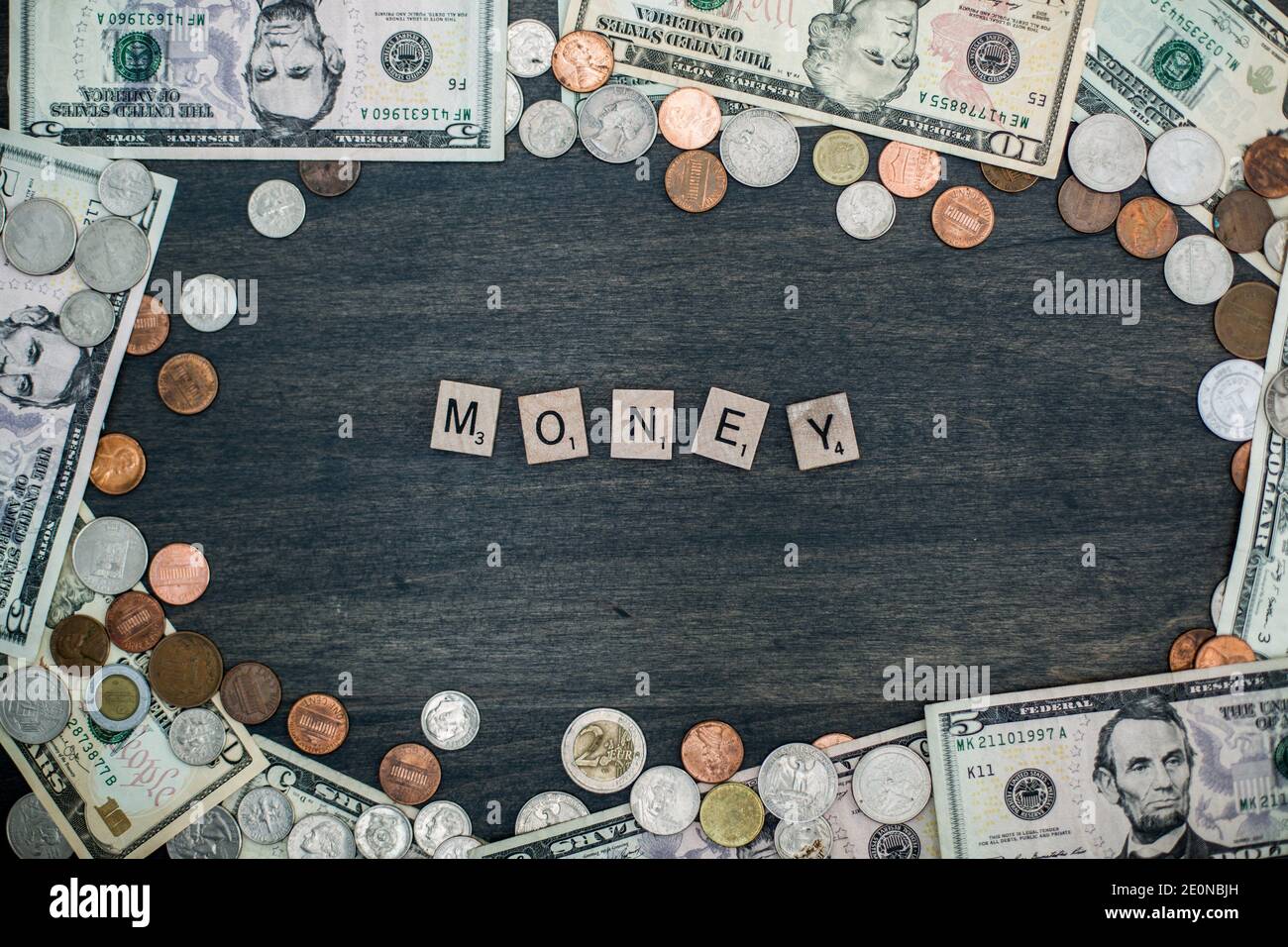 money letter tiles and coin Stock Photo - Alamy