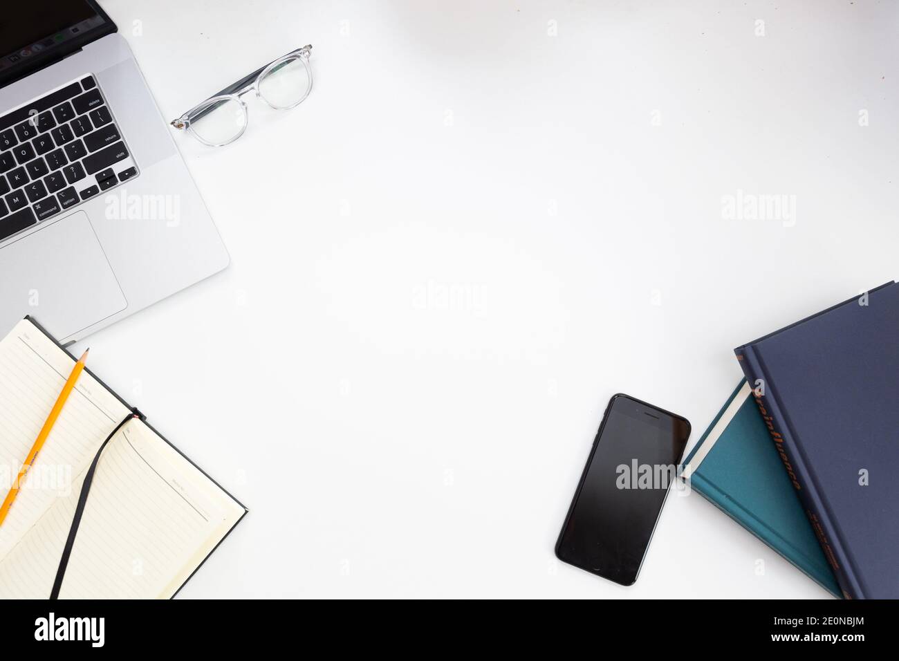 office work tools on the white desk Stock Photo - Alamy