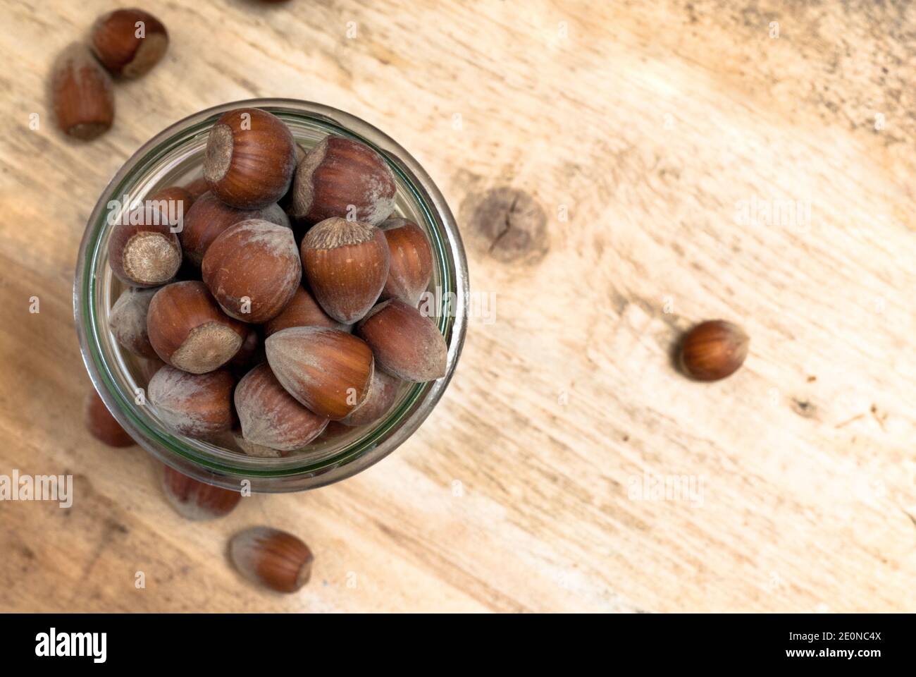 Glass full of hazelnuts view from above Stock Photo - Alamy