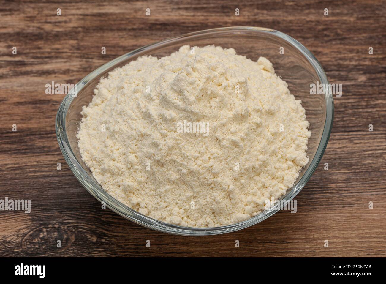 Wheat flour heap in the bowl for cooking Stock Photo - Alamy