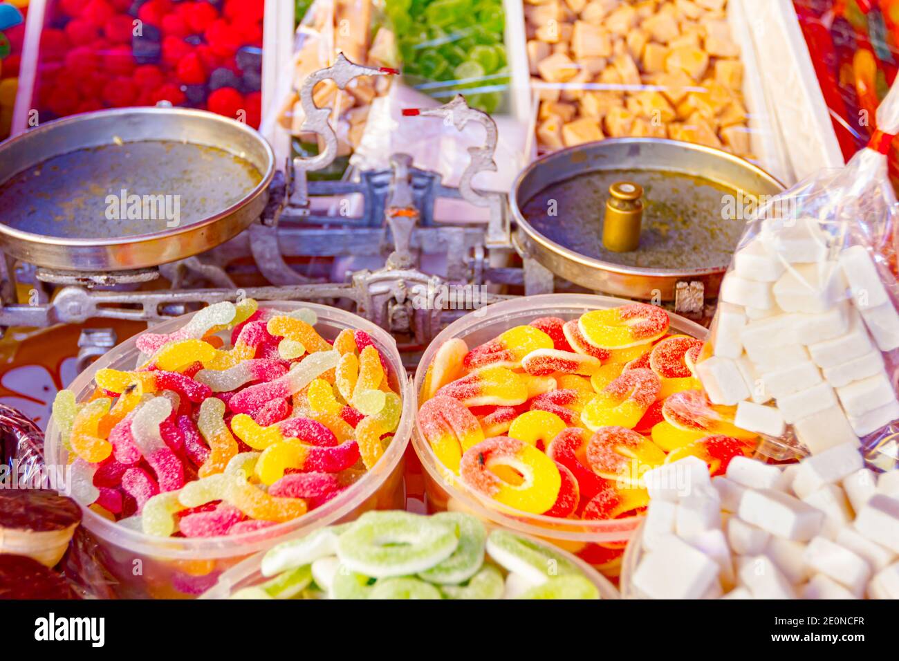 Various colored candies and sweets for sale placed in trays, available ...