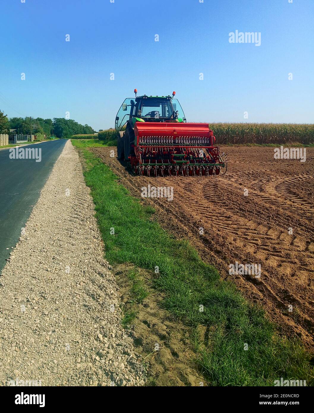 Tractor work the land on a farm Stock Photo - Alamy