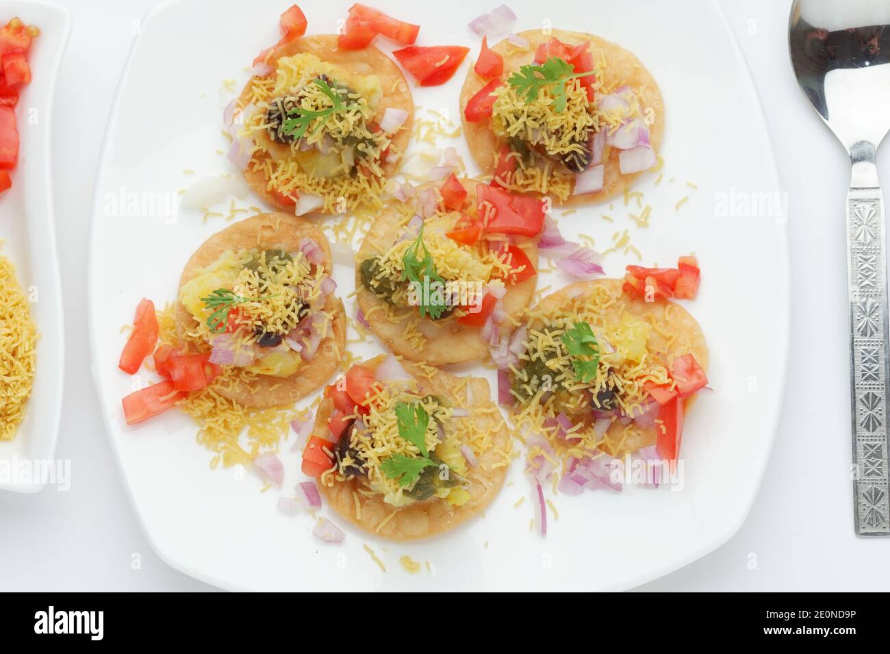 Sev Puri Fried flour (puri) topped with sev, onion,potato and other ...