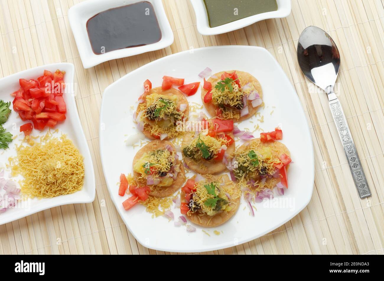 Sev Puri Fried flour (puri) topped with sev, onion,potato and other ...