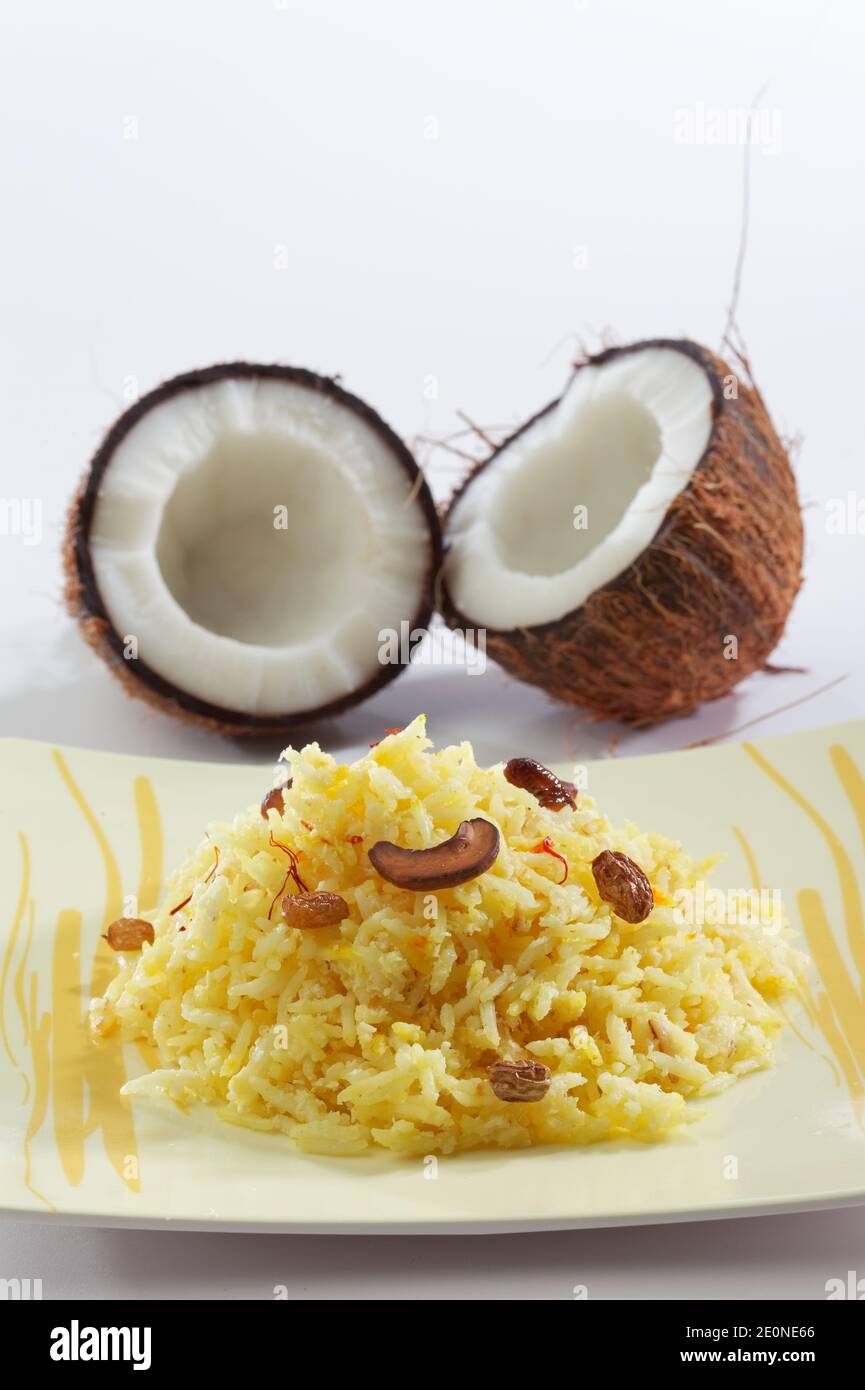 Sweet coconut rice with saffron and dry fruits Stock Photo - Alamy