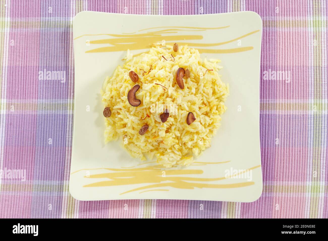 Sweet coconut rice with saffron and dry fruits Stock Photo - Alamy