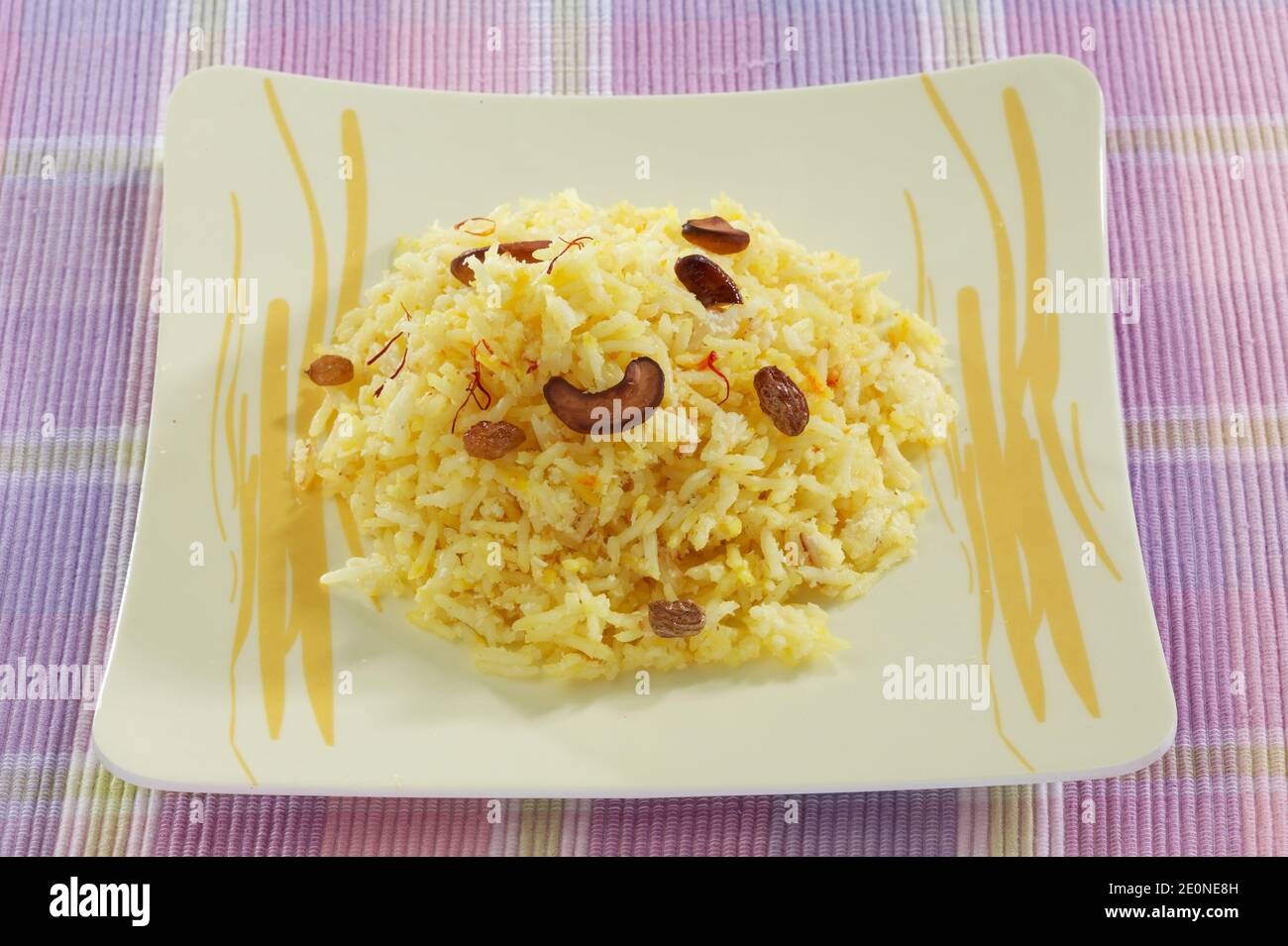 Sweet coconut rice with saffron and dry fruits Stock Photo - Alamy