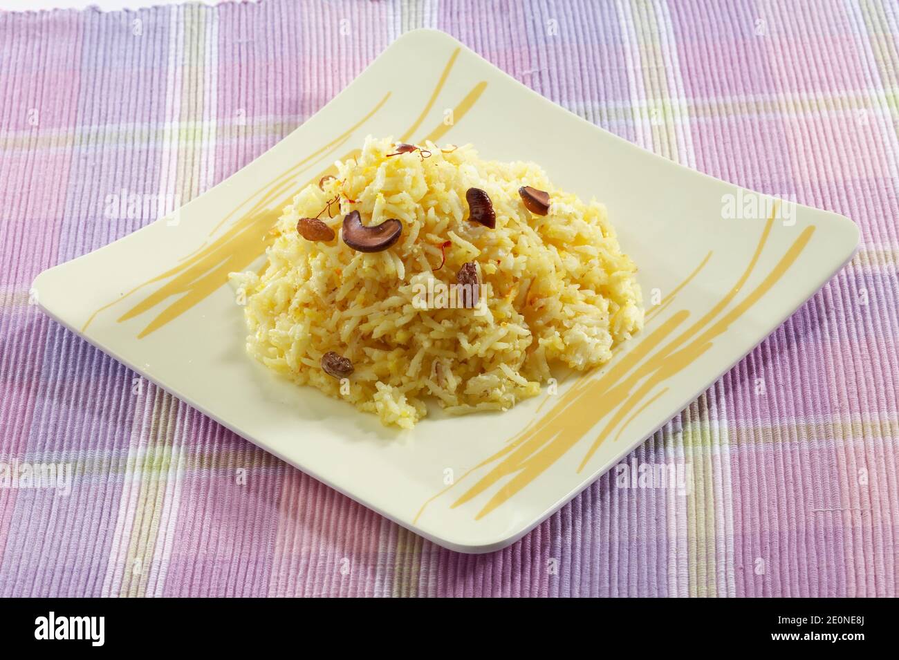 Sweet coconut rice with saffron and dry fruits Stock Photo - Alamy