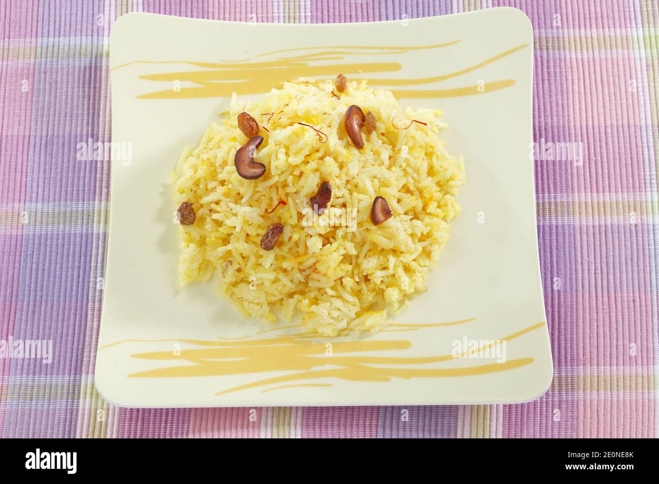 Sweet coconut rice with saffron and dry fruits Stock Photo - Alamy