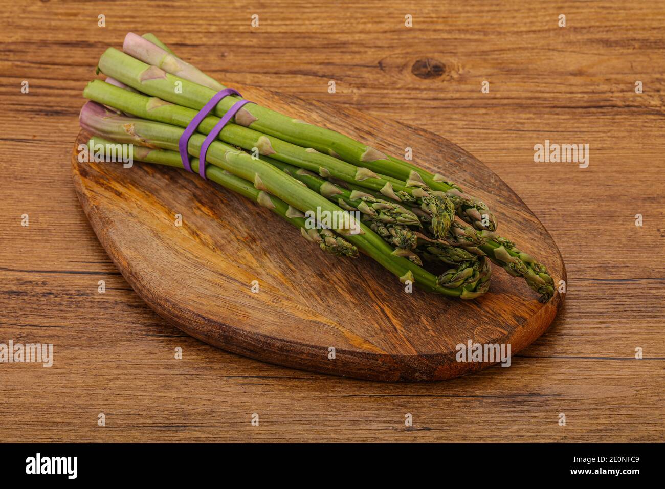 Vegan cuisine - Raw asparagus heap for cooking Stock Photo - Alamy