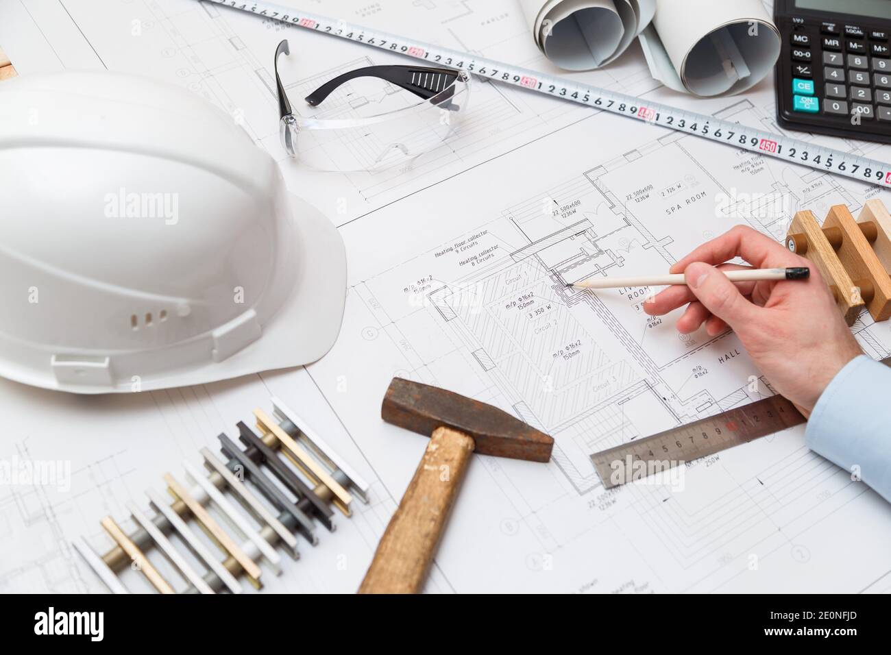 Concept architects or engineer holding pencil pointing equipment ...