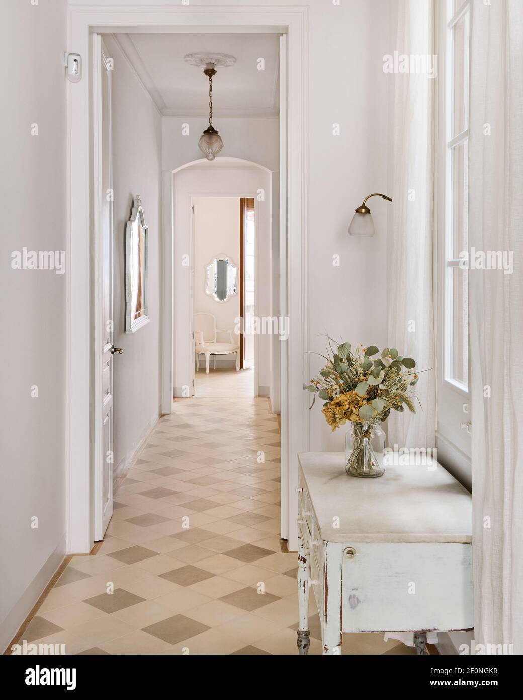 Hallway decorated in vintage style overlooking a long corridor Stock ...