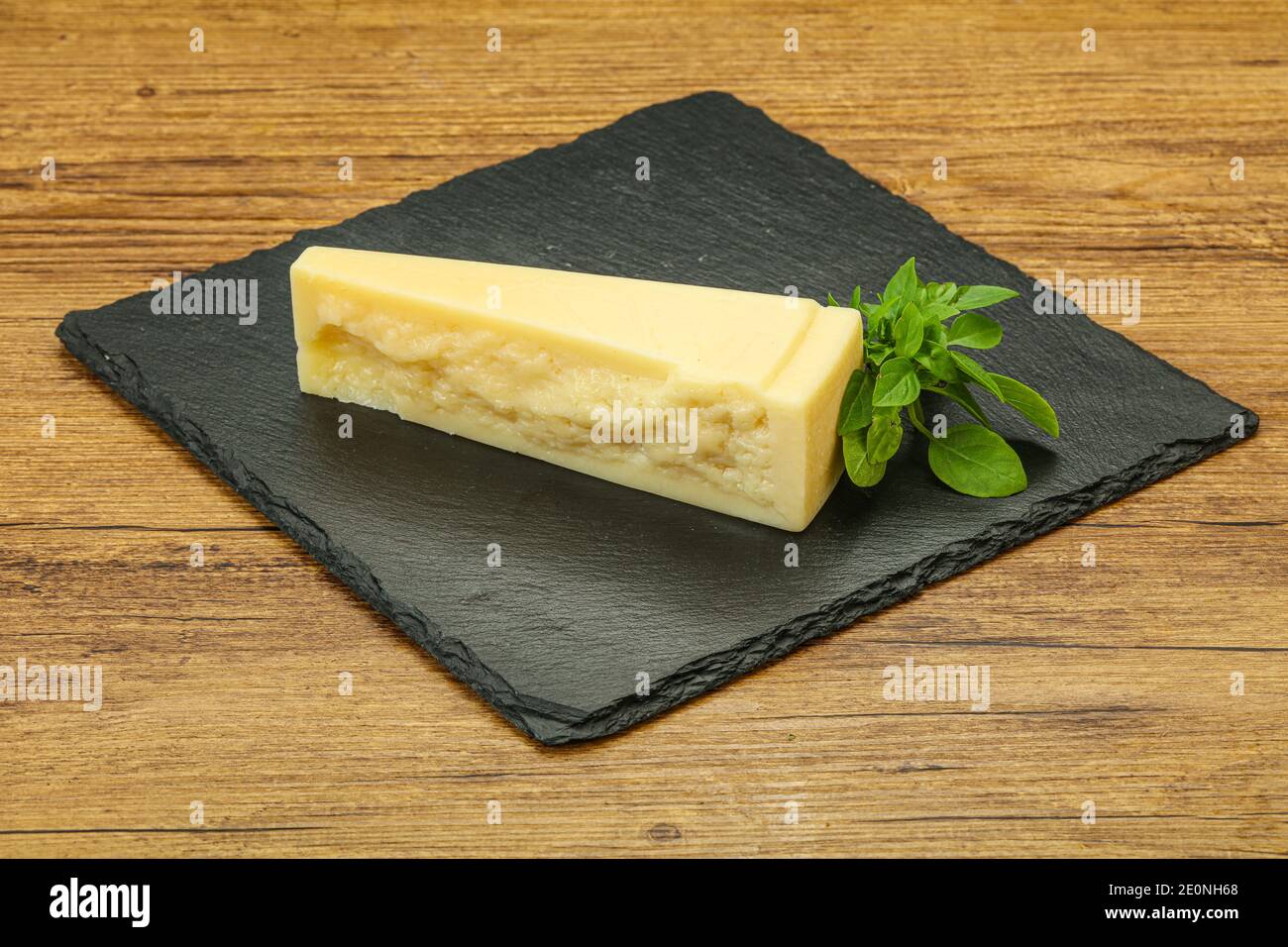 Hard parmesan cheese served basil leaves Stock Photo - Alamy