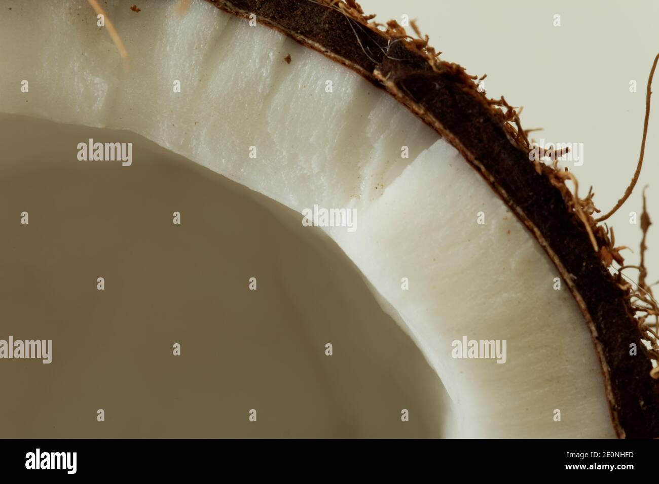 Coconut broken in two parts isolated shot in studio on white background ...