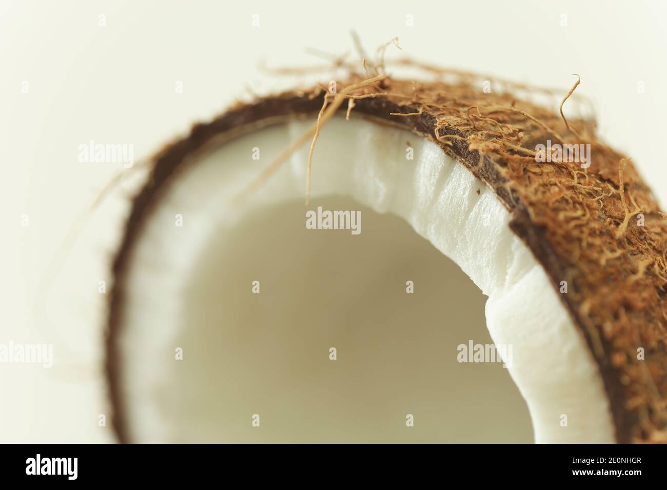 Coconut broken in two parts isolated shot in studio on white background ...