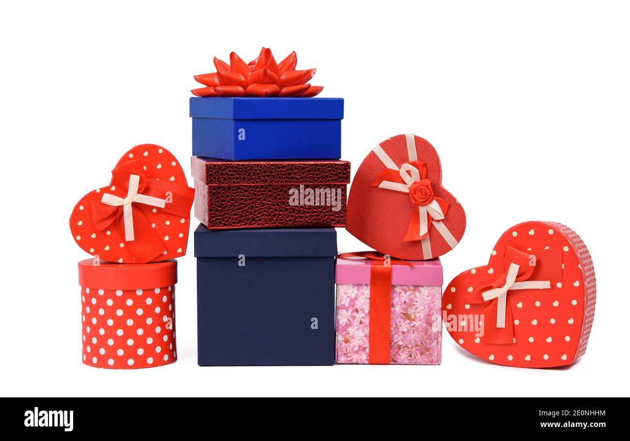 big stack of gifts wrapped in brown kraft paper and tied with silk ...