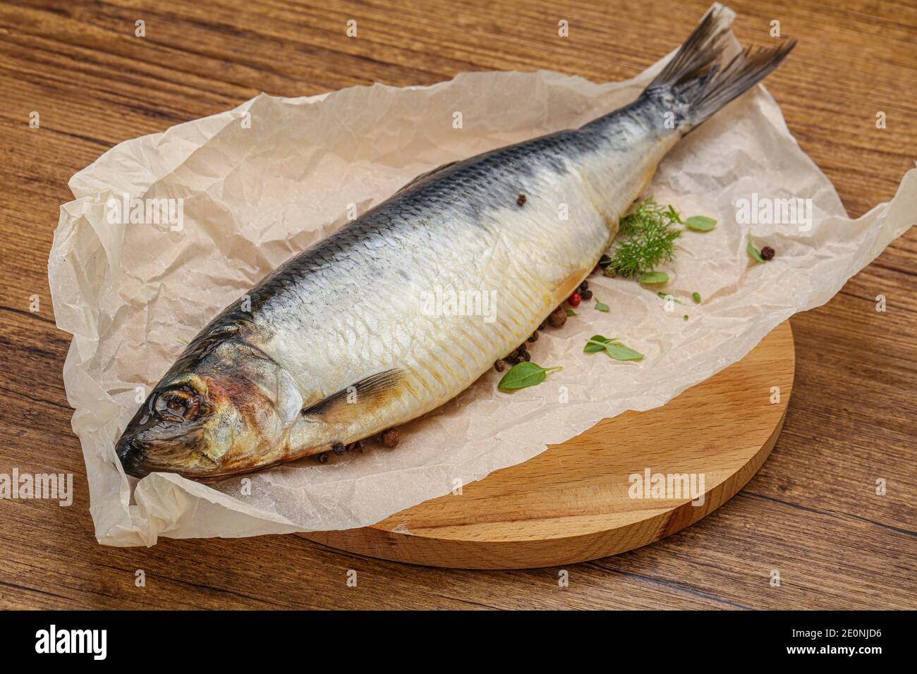 Salted Herring fish with pepper and spices Stock Photo - Alamy