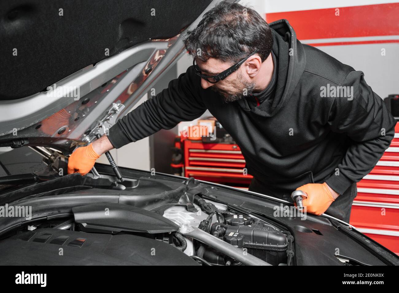Car mechanic working in repair garage hi-res stock photography and ...