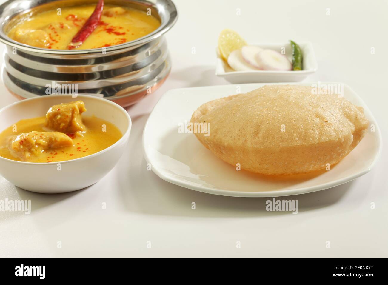 Indian Food: Kadhi with gatte, puri, chapati, ready to eat Stock Photo ...