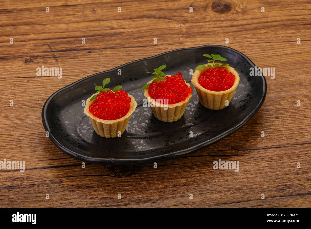 Apetizer - tartlet with red caviar snack Stock Photo - Alamy