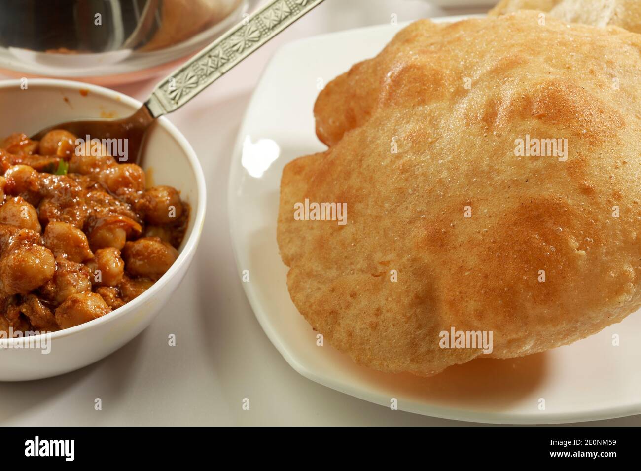 Indian food - chana masala with Indian spices, roti, puri Stock Photo ...