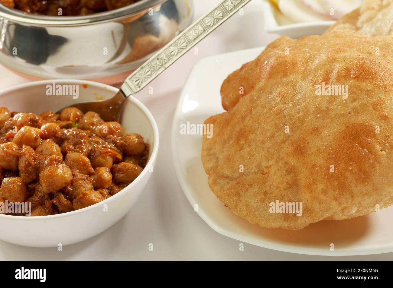 Indian food - chana masala with Indian spices, roti, puri Stock Photo ...