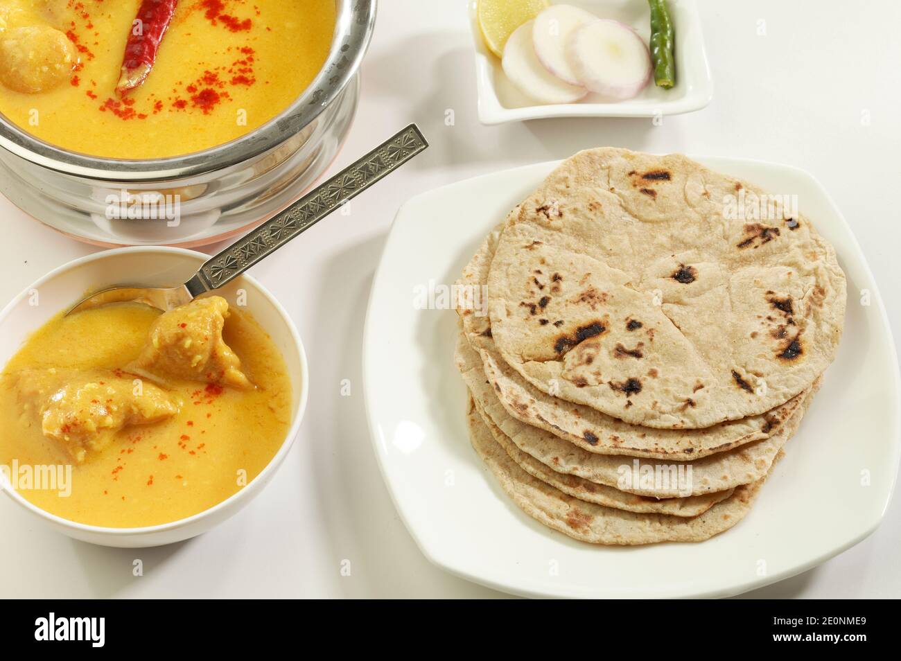 Indian Food: Kadhi with gatte, puri, chapati, ready to eat Stock Photo ...