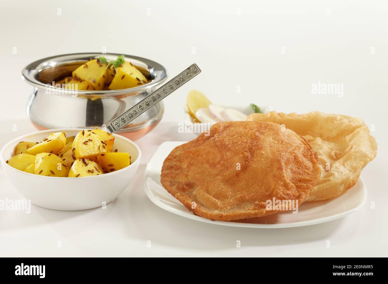 Indian food-cooked spicy potato preparation , chapati, puri, tadka ...