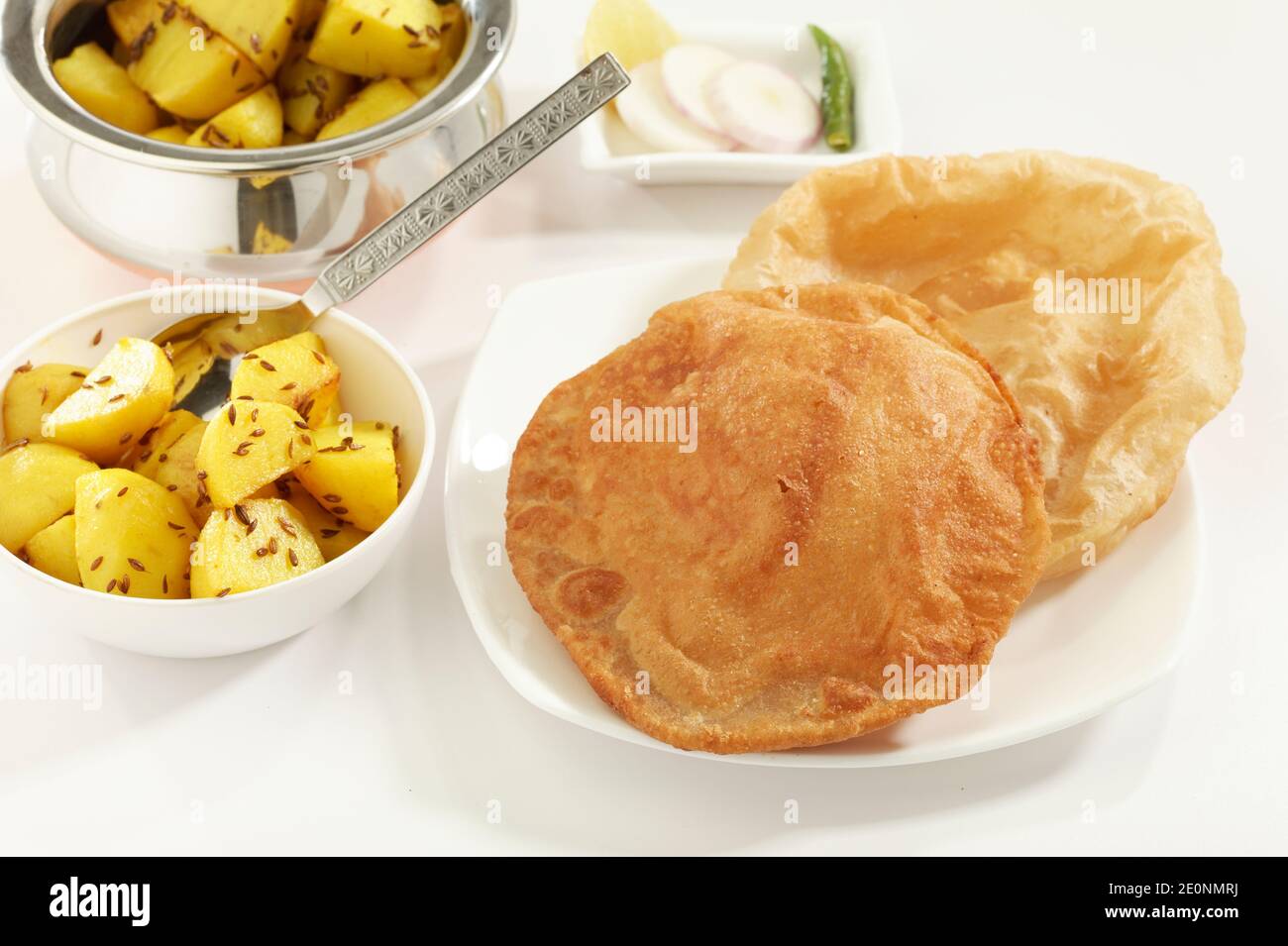 Indian food-cooked spicy potato preparation , chapati, puri, tadka ...