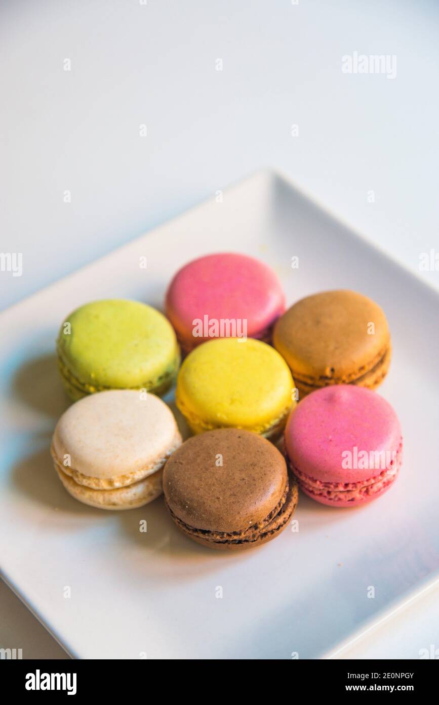 Assorted macarons in a dish Stock Photo - Alamy