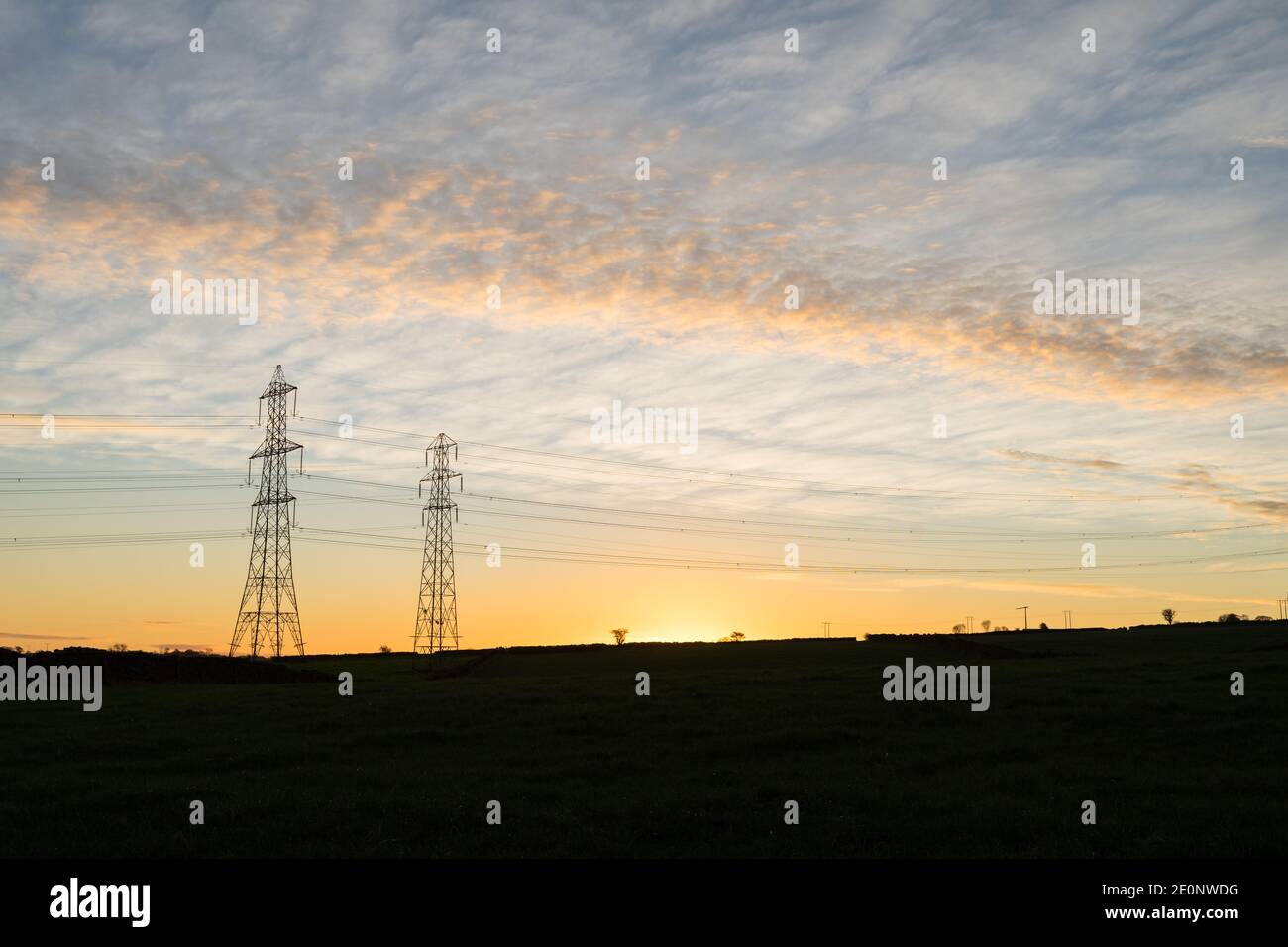 Power lines and Pylons in rural setting at sunrise - Penistone, England ...