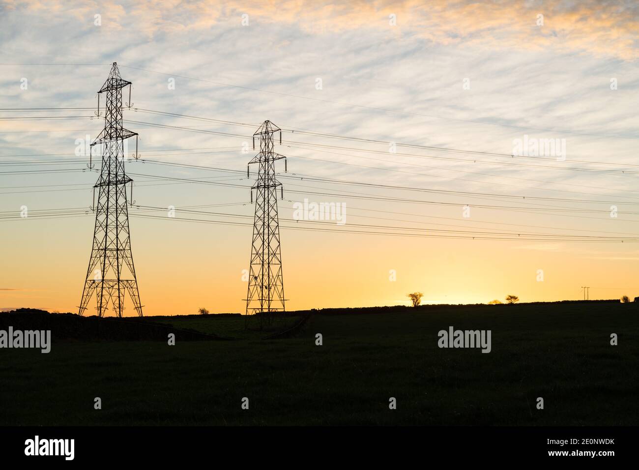 Power lines and Pylons in rural setting at sunrise - Penistone, England ...