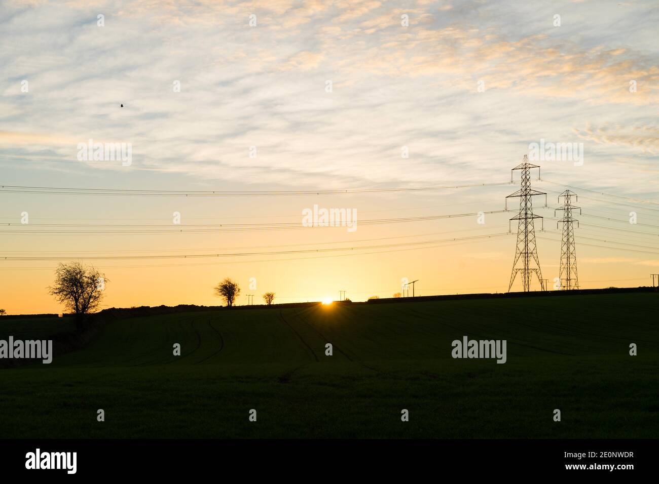 Power lines and Pylons in rural setting at sunrise - Penistone, England ...