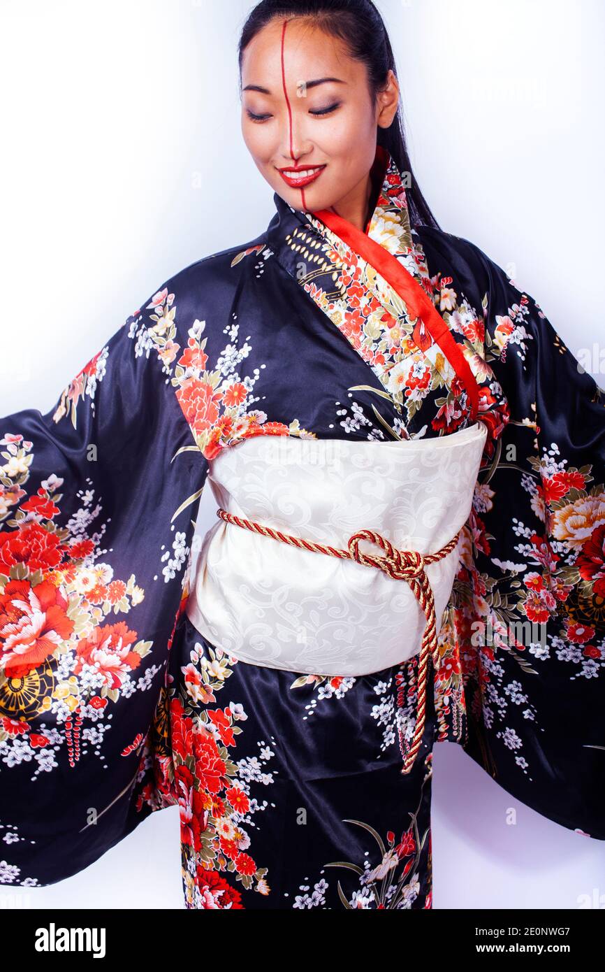young pretty geisha in black kimono with sakura, asian ethno closeup on ...