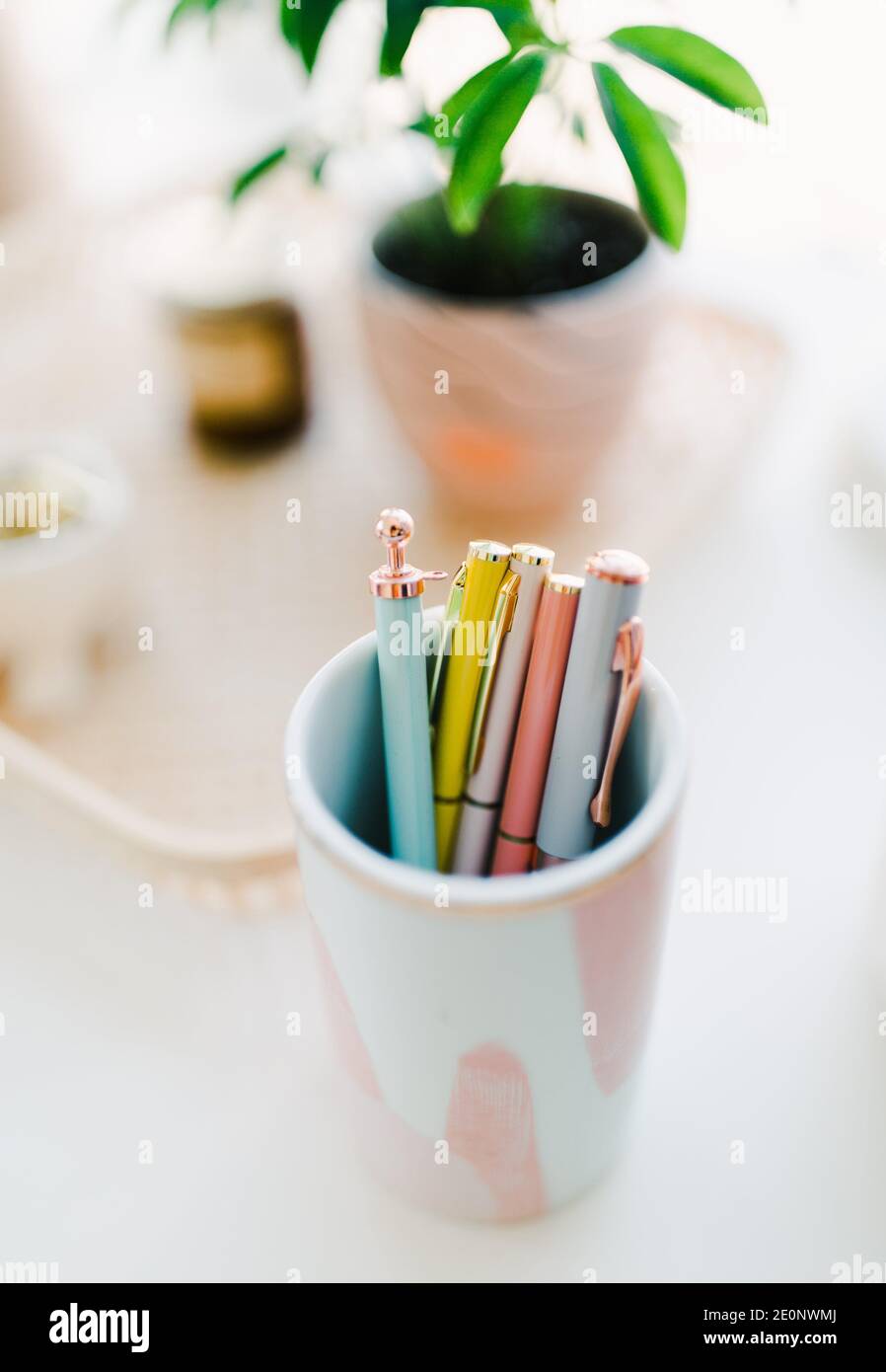 pink cup full of pens Stock Photo - Alamy
